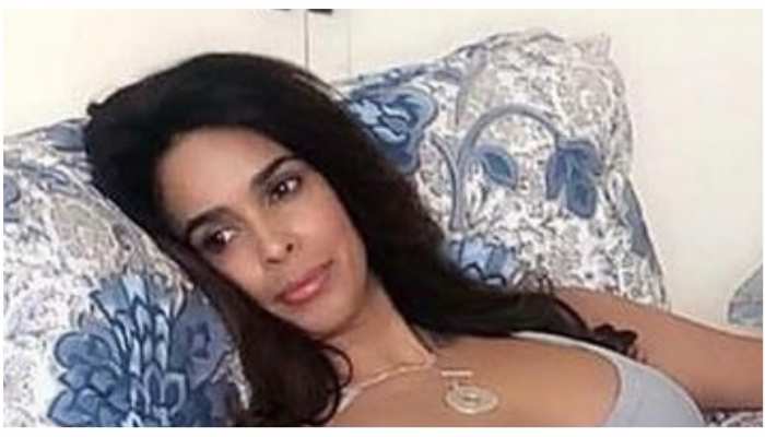 Mallika Sherawat sizzle at the age of 46 look super sexy on the couch look wear bra and pantie